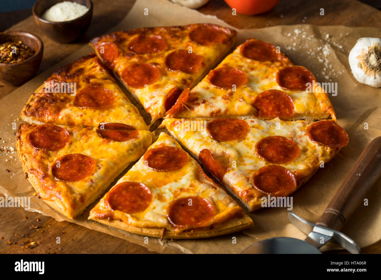 Cheap Greasy Frozen Pepperoni Pizza Ready to Eat Stock Photo - Alamy