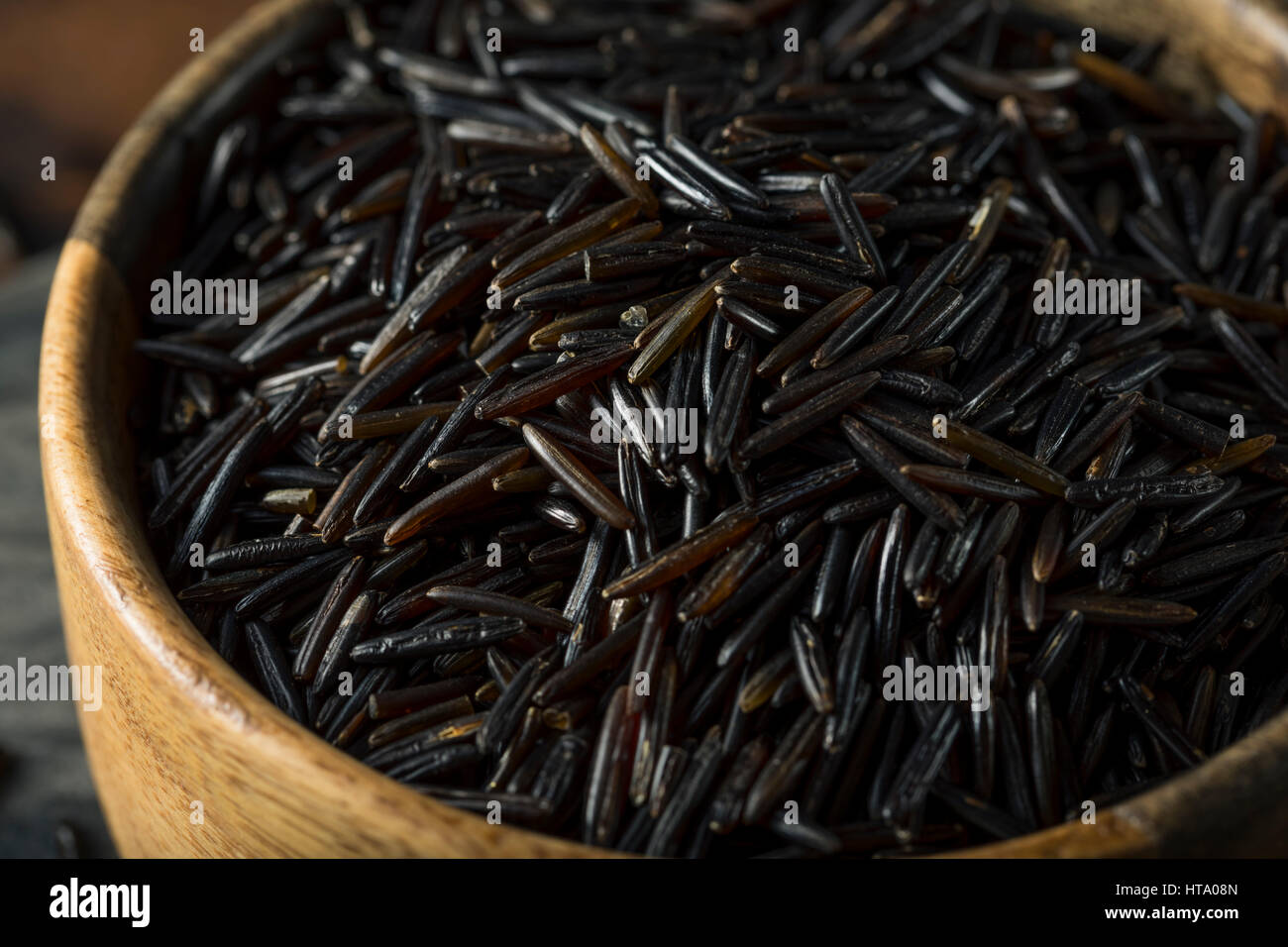 Organic Dry Black Wild Rice in a Bowl Stock Photo - Alamy