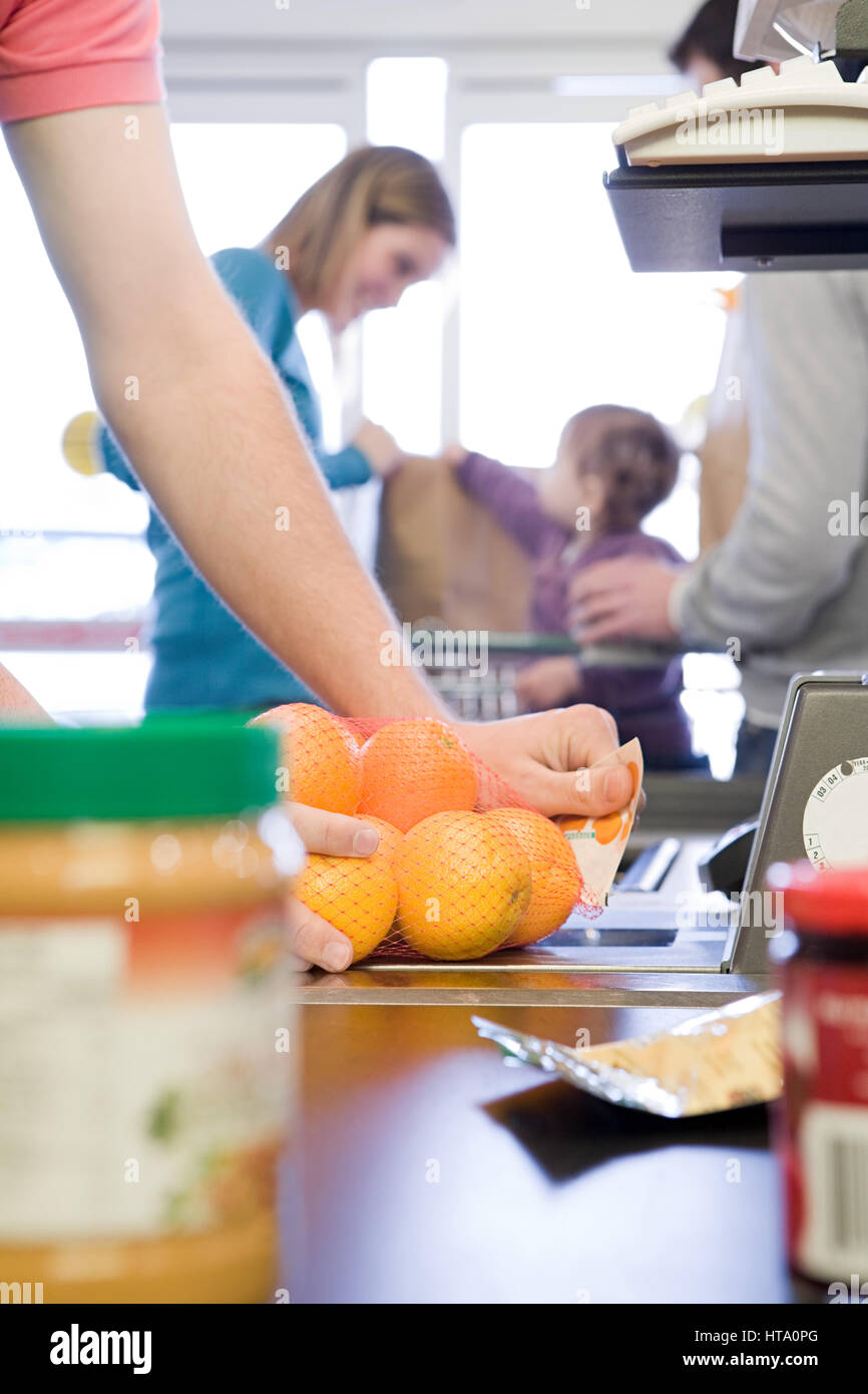 People at supermarket checkout Stock Photo - Alamy