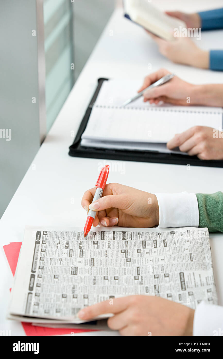 People with newspaper and books Stock Photo - Alamy