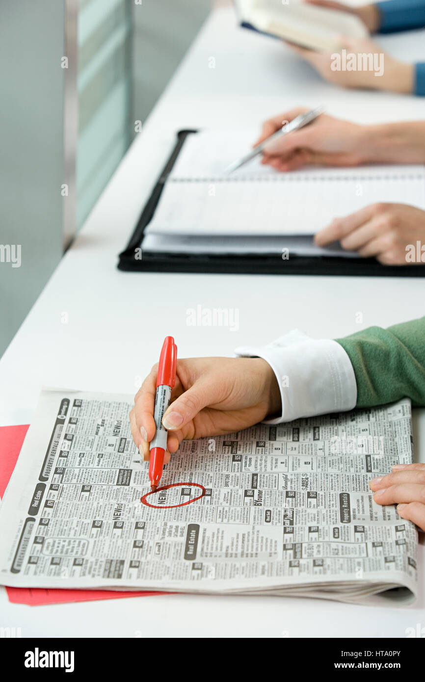 People with newspaper and books Stock Photo - Alamy