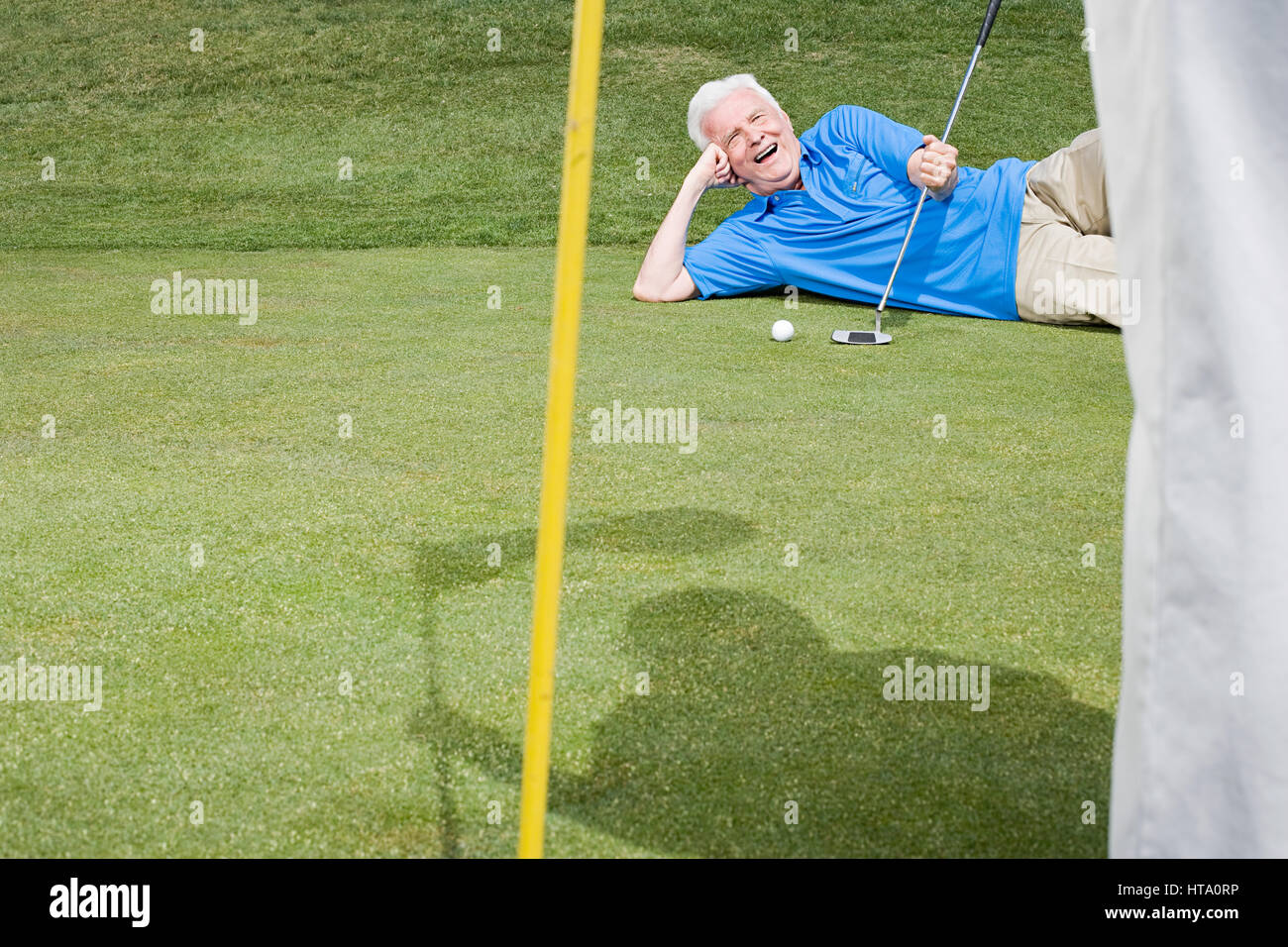 Man on a golf course Stock Photo - Alamy
