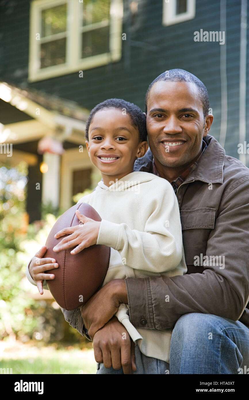 Father and son with football Stock Photo - Alamy