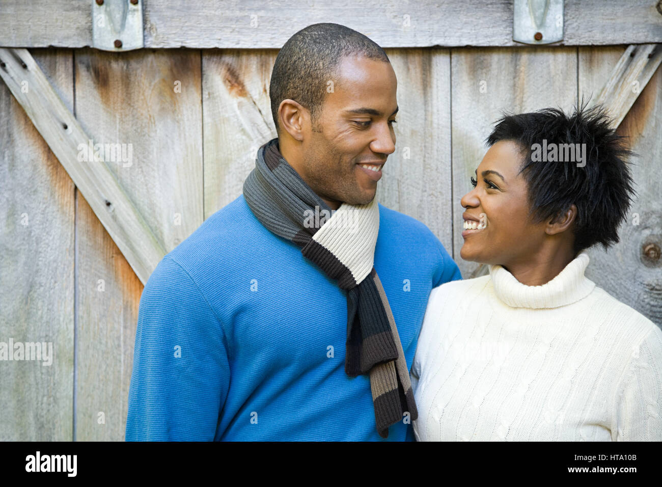 Couple smiling at each other Stock Photo - Alamy