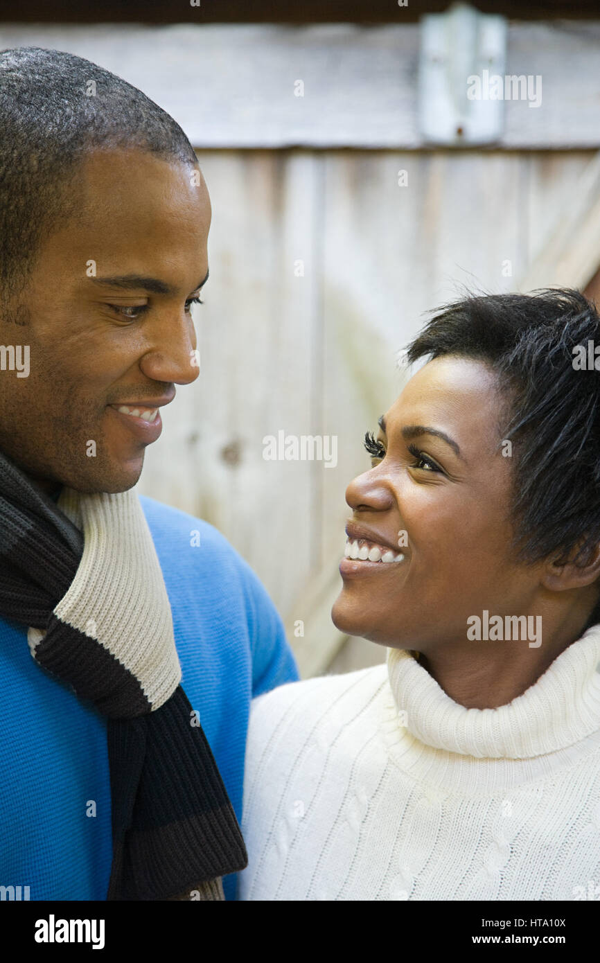 Couple smiling at each other Stock Photo - Alamy
