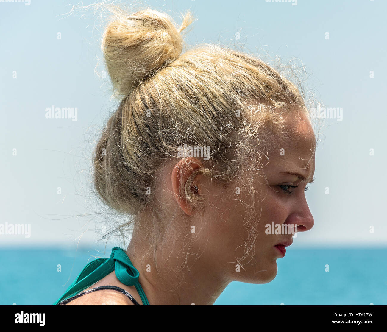 Against the background of sea horizon Girl looking away sad look Stock ...