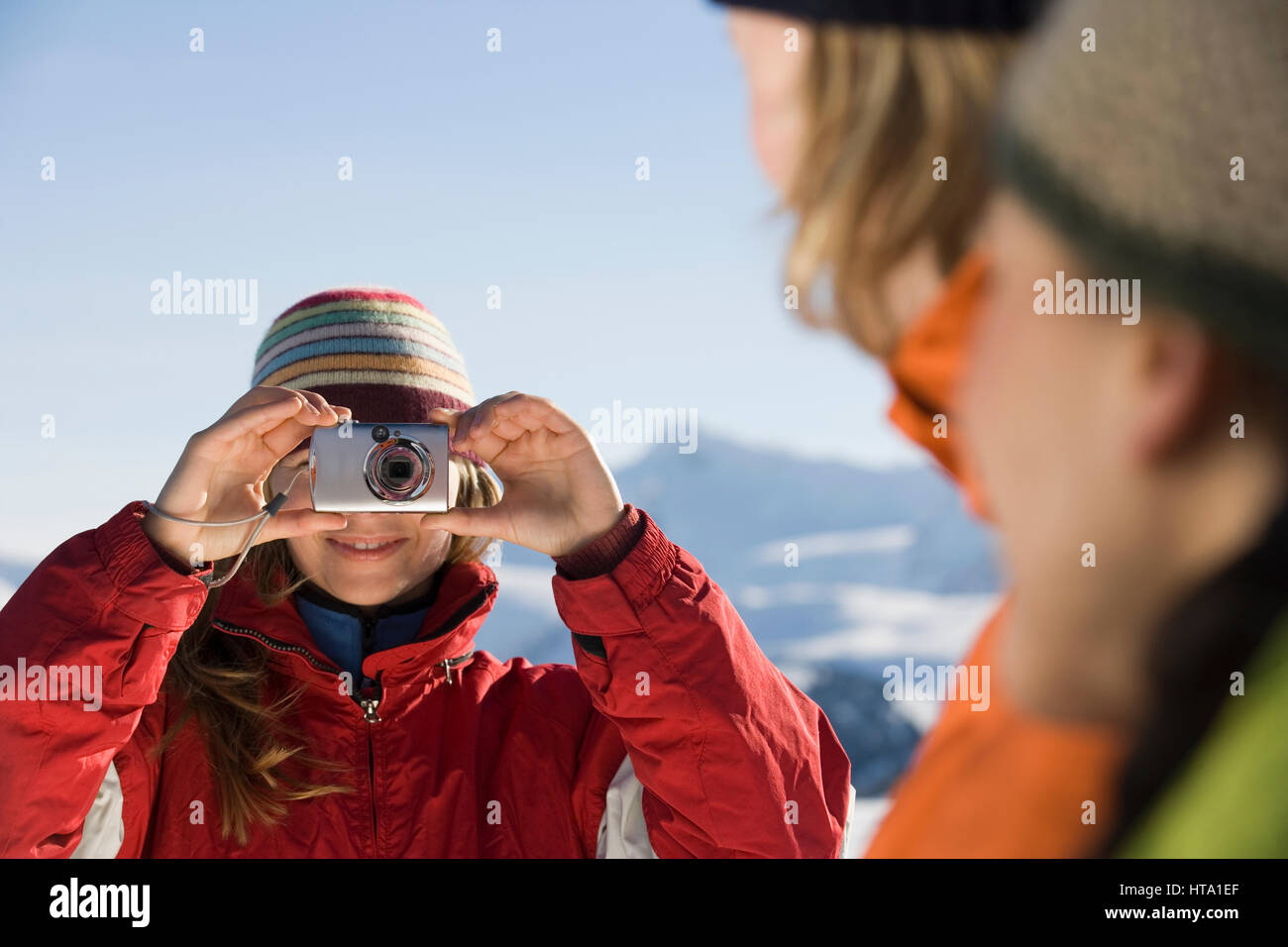 woman photographing her friends Stock Photo - Alamy