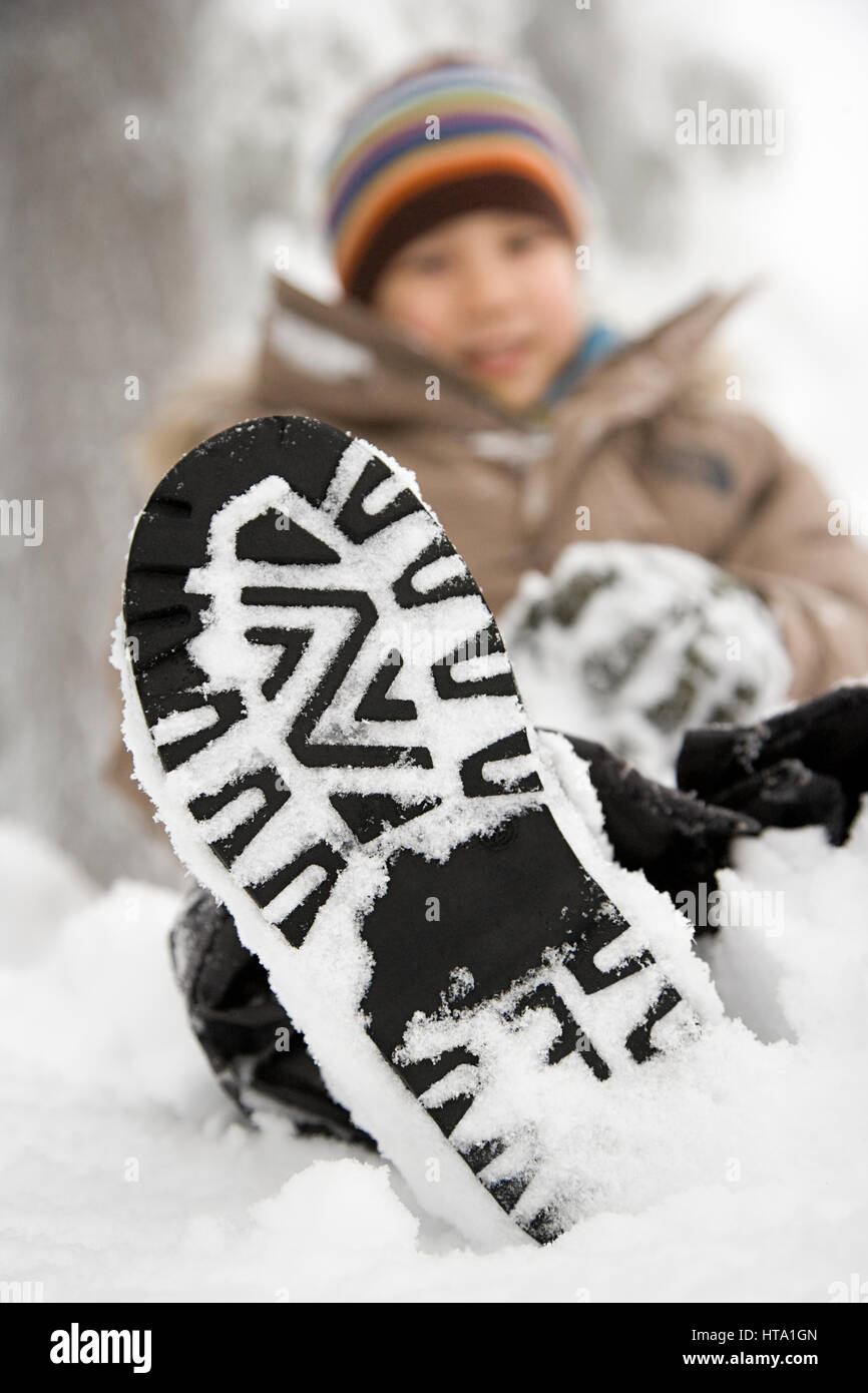 Boy with snow on his shoe Stock Photo - Alamy