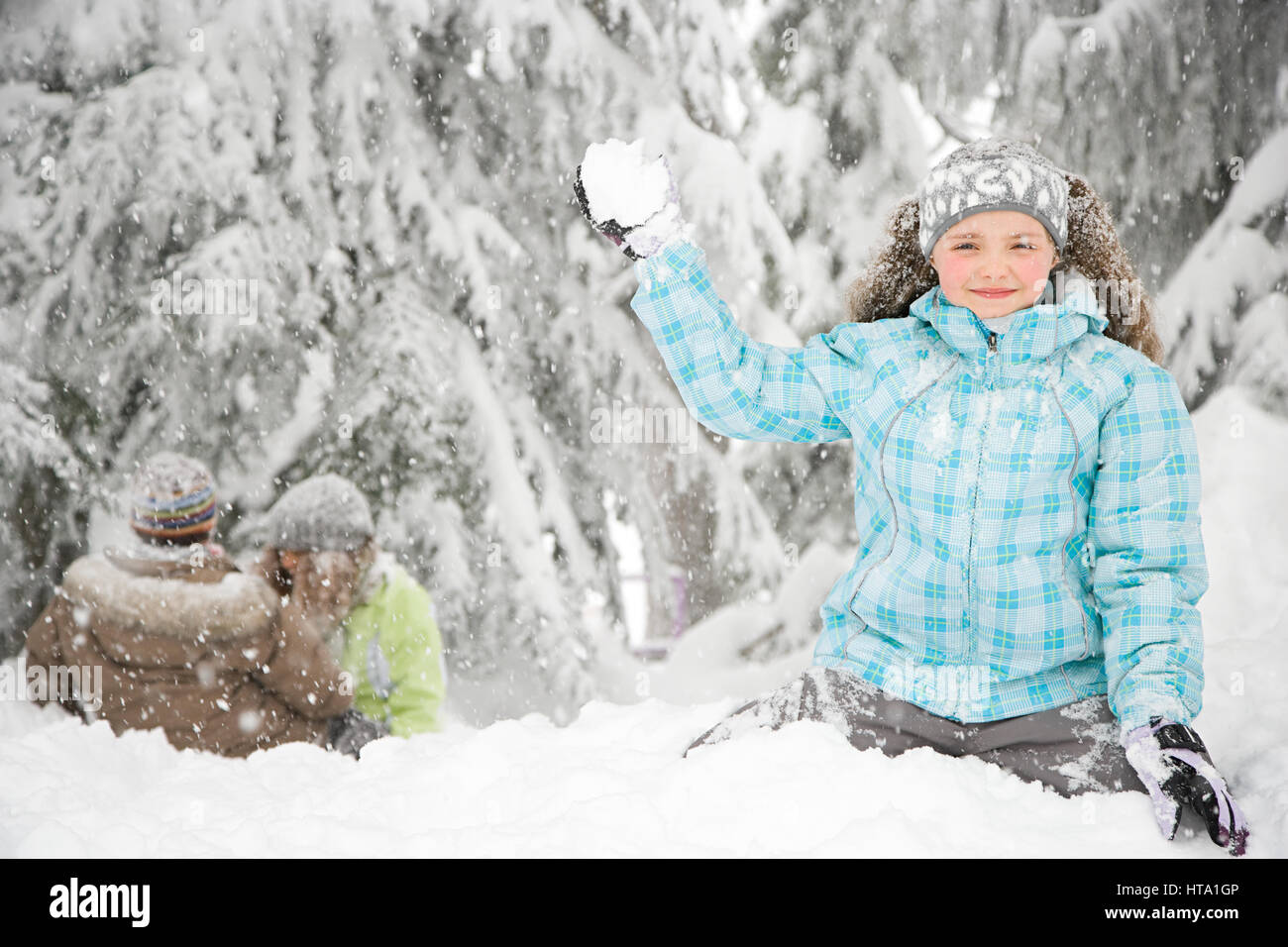 Girl with snowball Stock Photo - Alamy