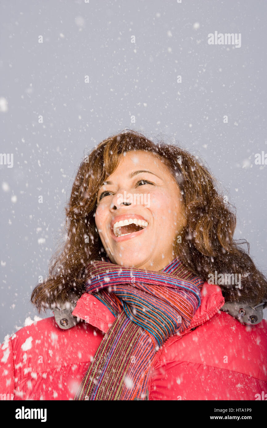 Woman laughing in the snow Stock Photo - Alamy