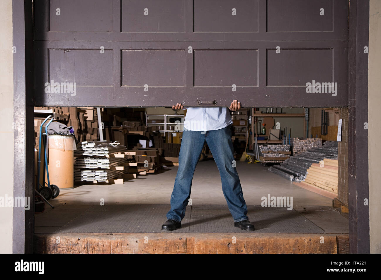 Opening warehouse door Stock Photo - Alamy