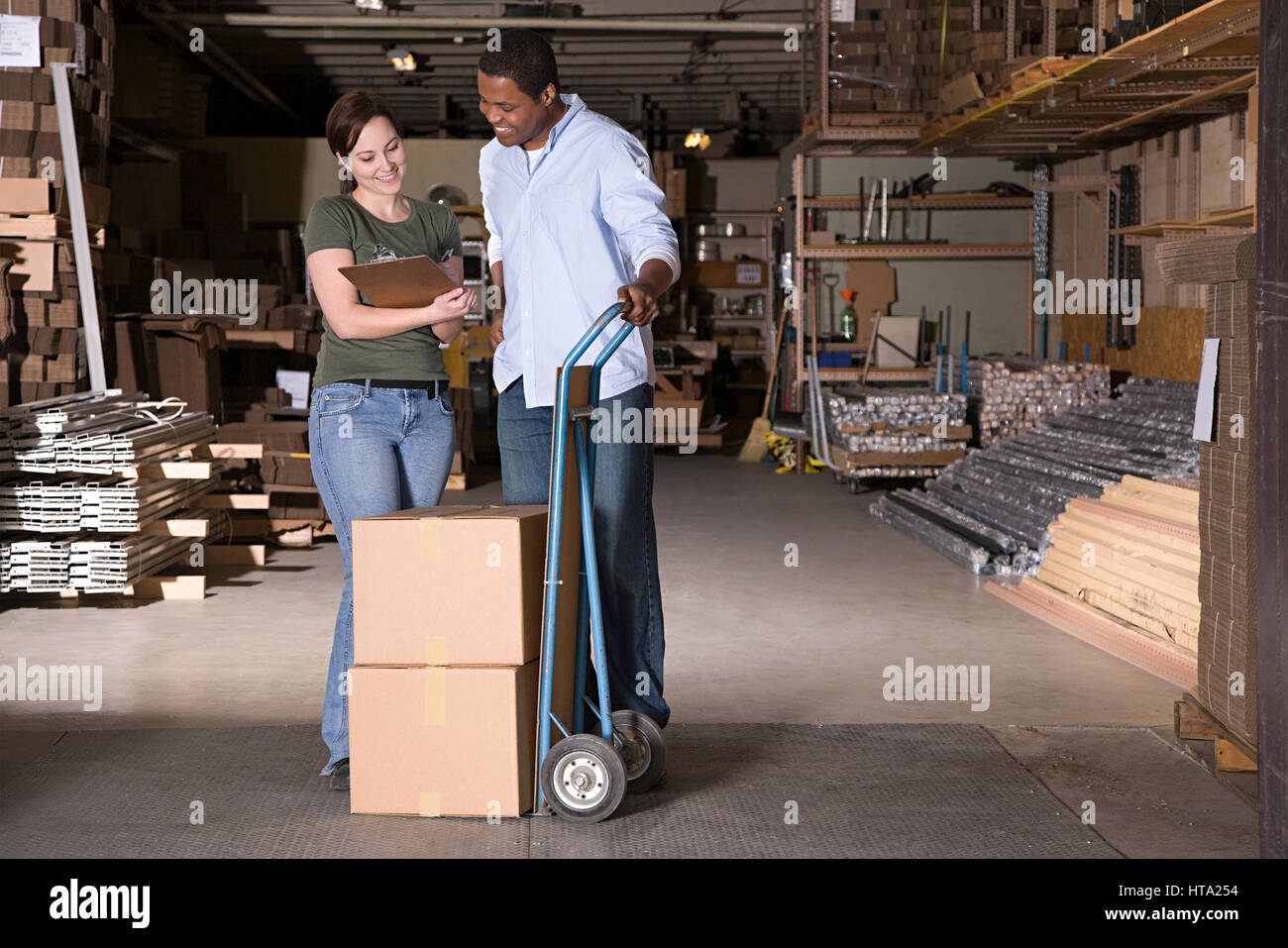 Colleagues in warehouse Stock Photo - Alamy