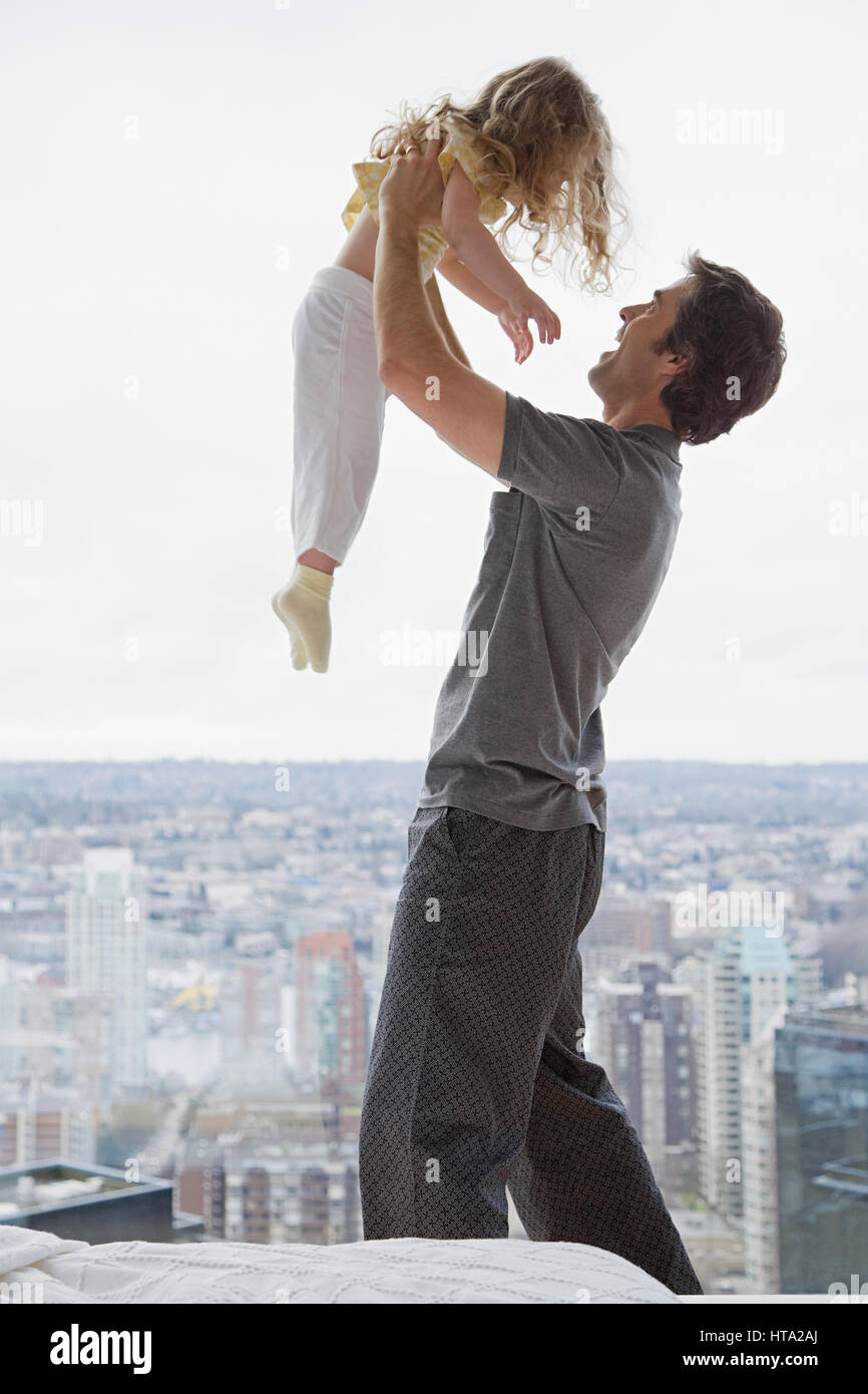 father lifting his daughter Stock Photo - Alamy