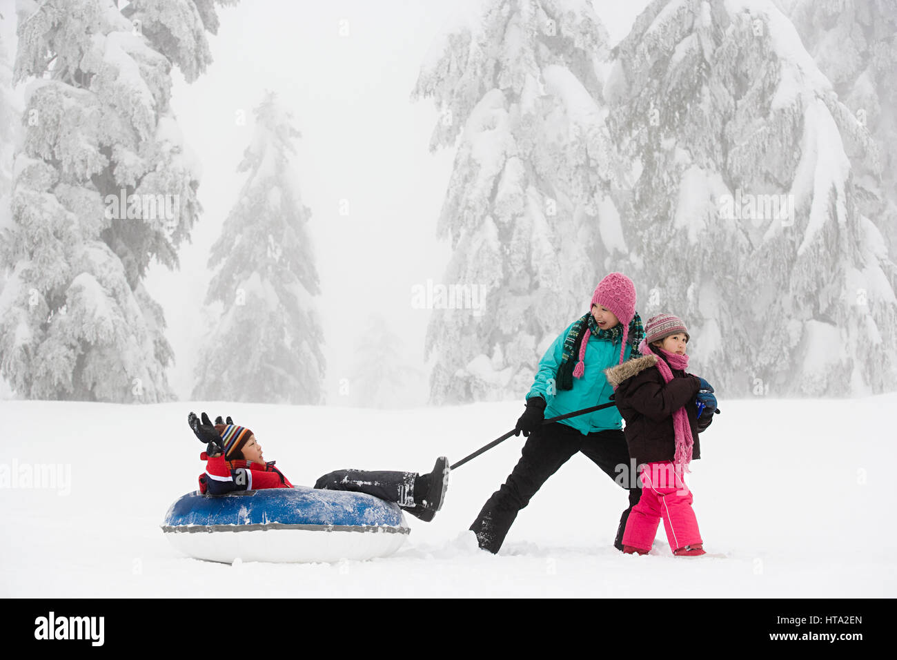 Boy on inflatable toboggan Stock Photo - Alamy