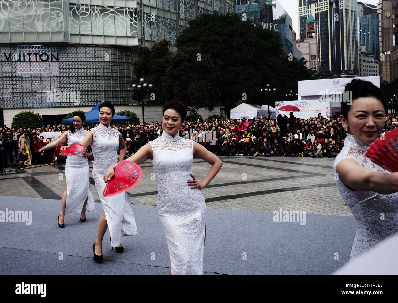 Chongqing, China. 8th Mar, 2017. More than 500 women present cheongsam ...