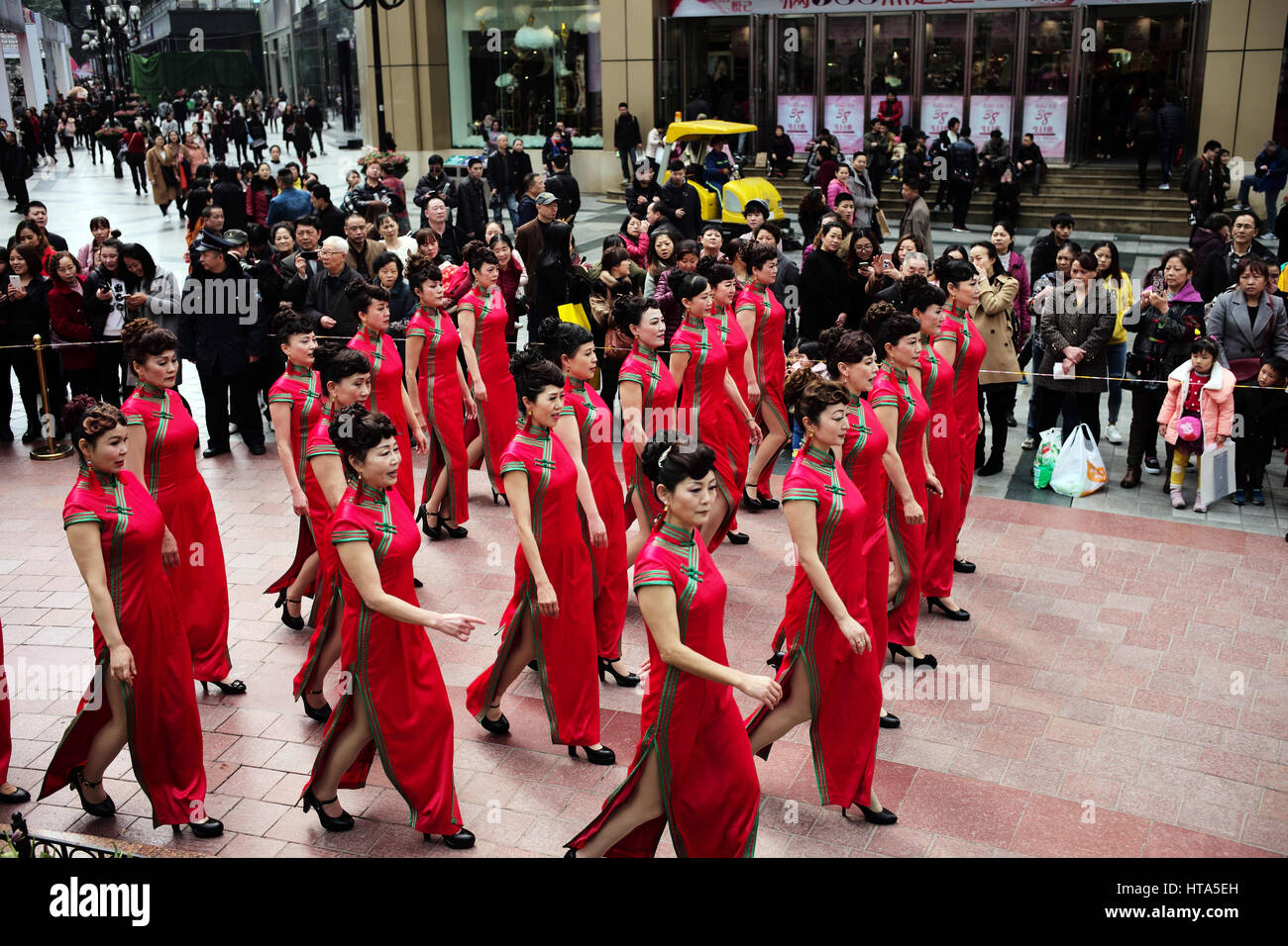 Chongqing, China. 8th Mar, 2017. More than 500 women present cheongsam ...