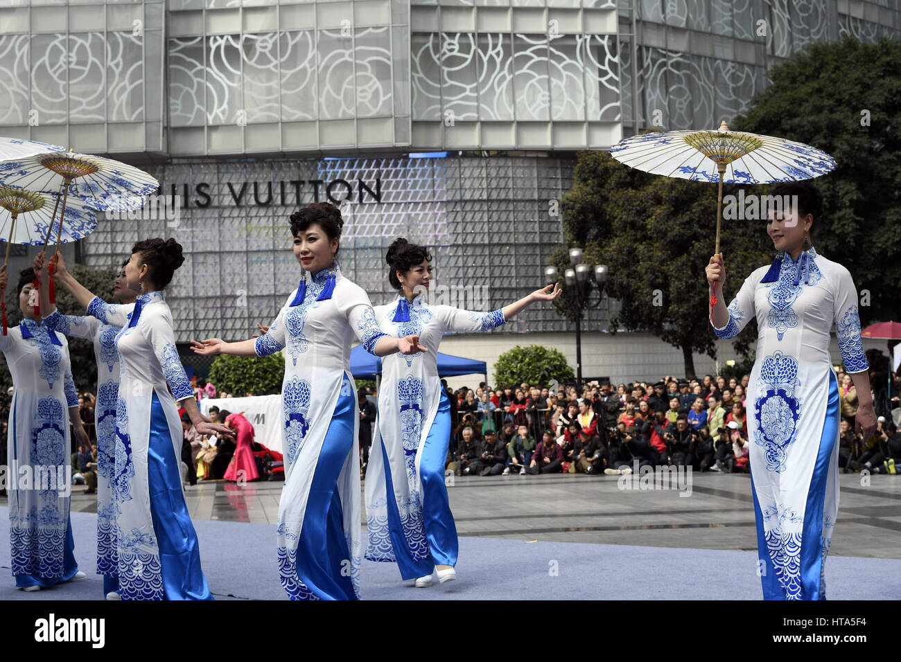 Chongqing, China. 8th Mar, 2017. More than 500 women present cheongsam ...