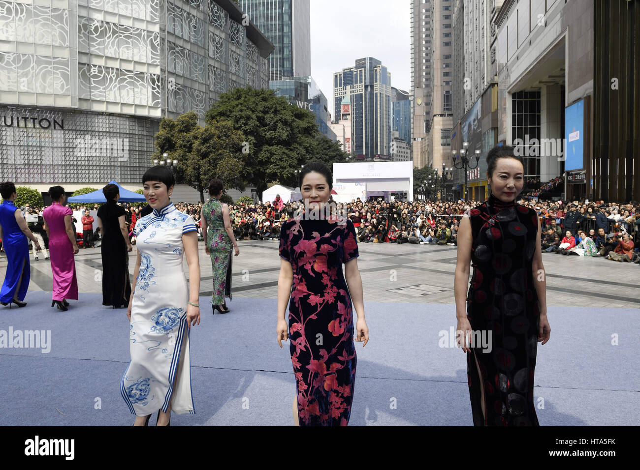 Chongqing, China. 8th Mar, 2017. More than 500 women present cheongsam ...