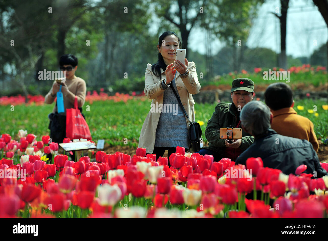 Nanchang, China's Jiangxi Province. 9th Mar, 2017. Tourists enjoy ...
