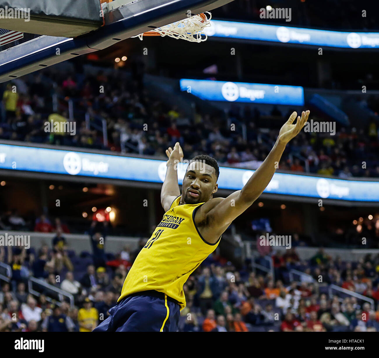 March 9, 2017: Michigan Wolverines G/F #21 Zak Irvin falls backward ...
