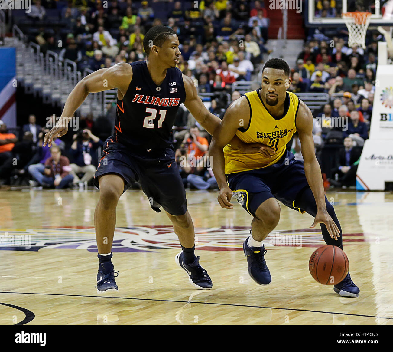 March 9, 2017: Michigan Wolverines G/F #21 Zak Irvin takes Illinois Fighting Illini G #21 ...