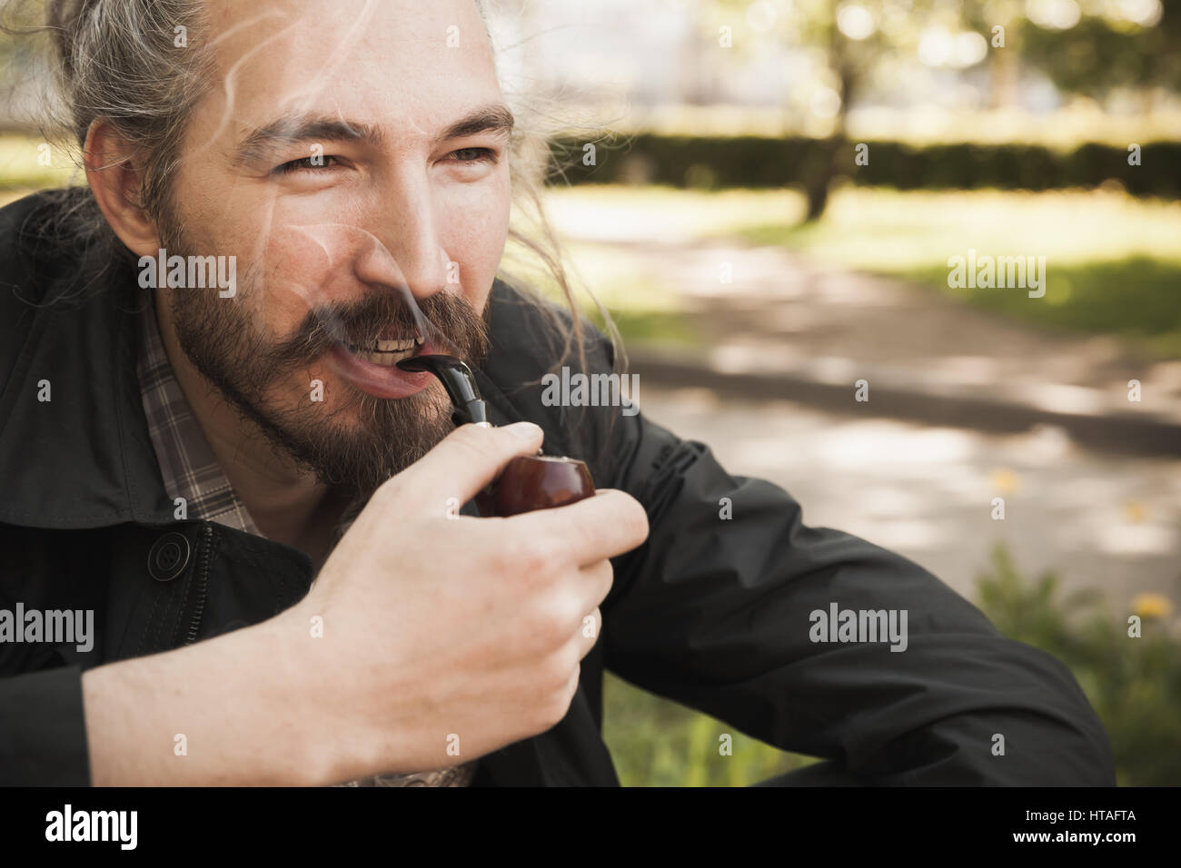 Gentleman smoking pipe sitting hi-res stock photography and images - Alamy