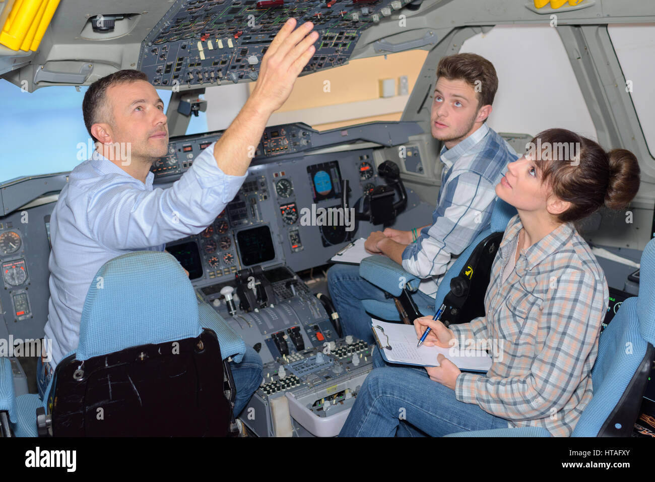 Students with instructor in aircraft cockpit Stock Photo - Alamy