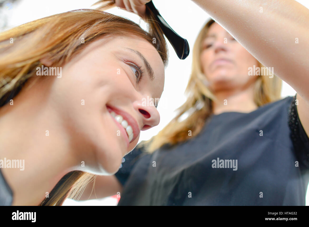 girl having a service in a parlor Stock Photo - Alamy