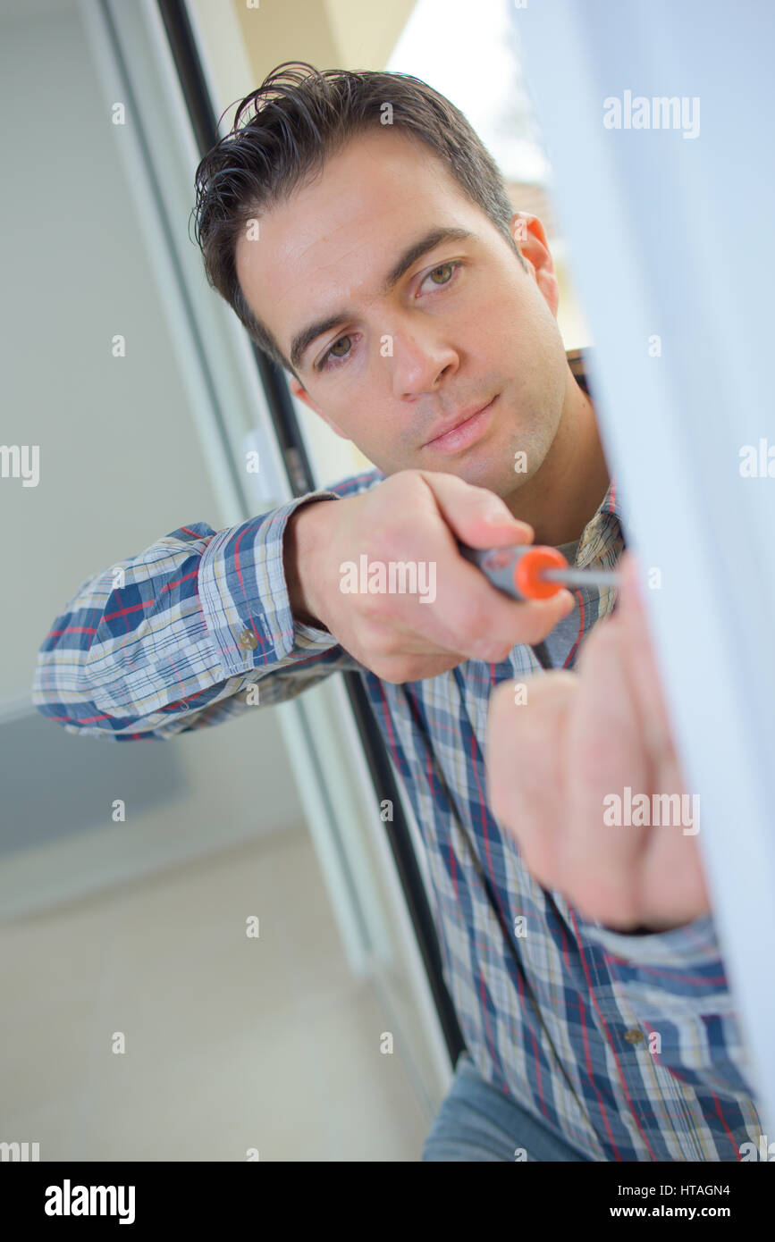 Man using screwdriver Stock Photo - Alamy