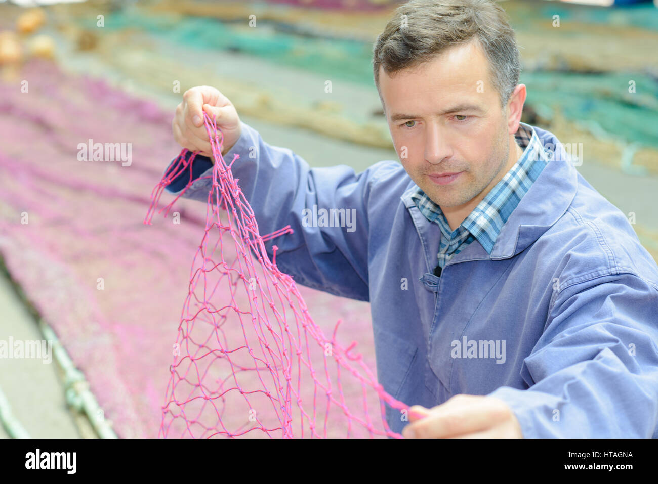 tear in the net Stock Photo - Alamy