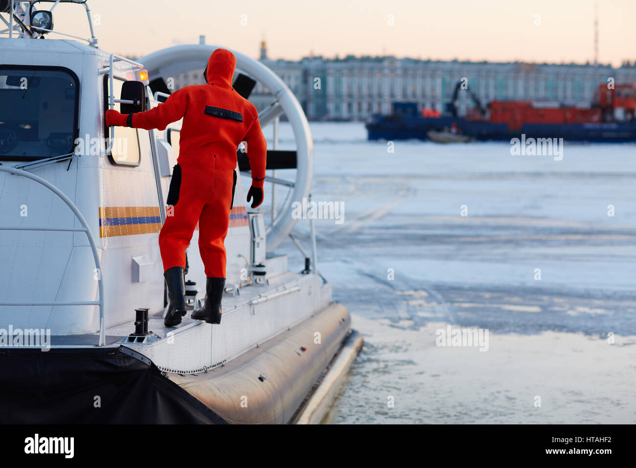 Worker of coast guard team on rescue boat Stock Photo - Alamy