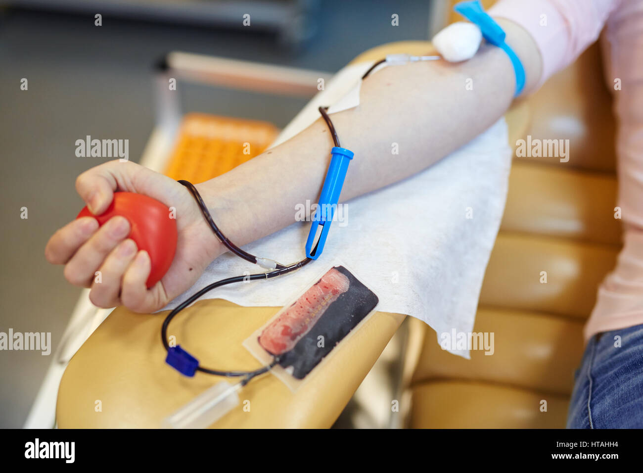 Human hand gripping flexor during hemotransfusion Stock Photo - Alamy