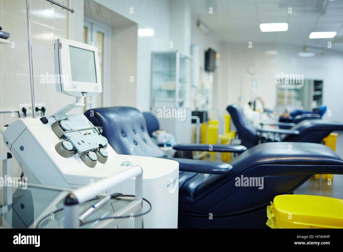 Donor platelets blood separation machine and empty armchair near by ...