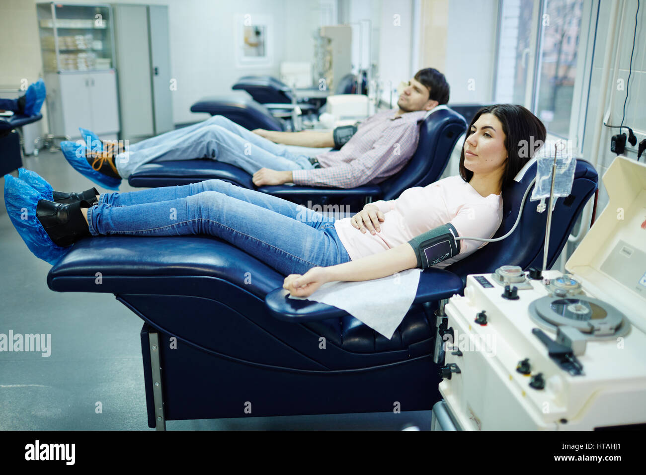 Woman volunteer donating blood hi-res stock photography and images - Alamy