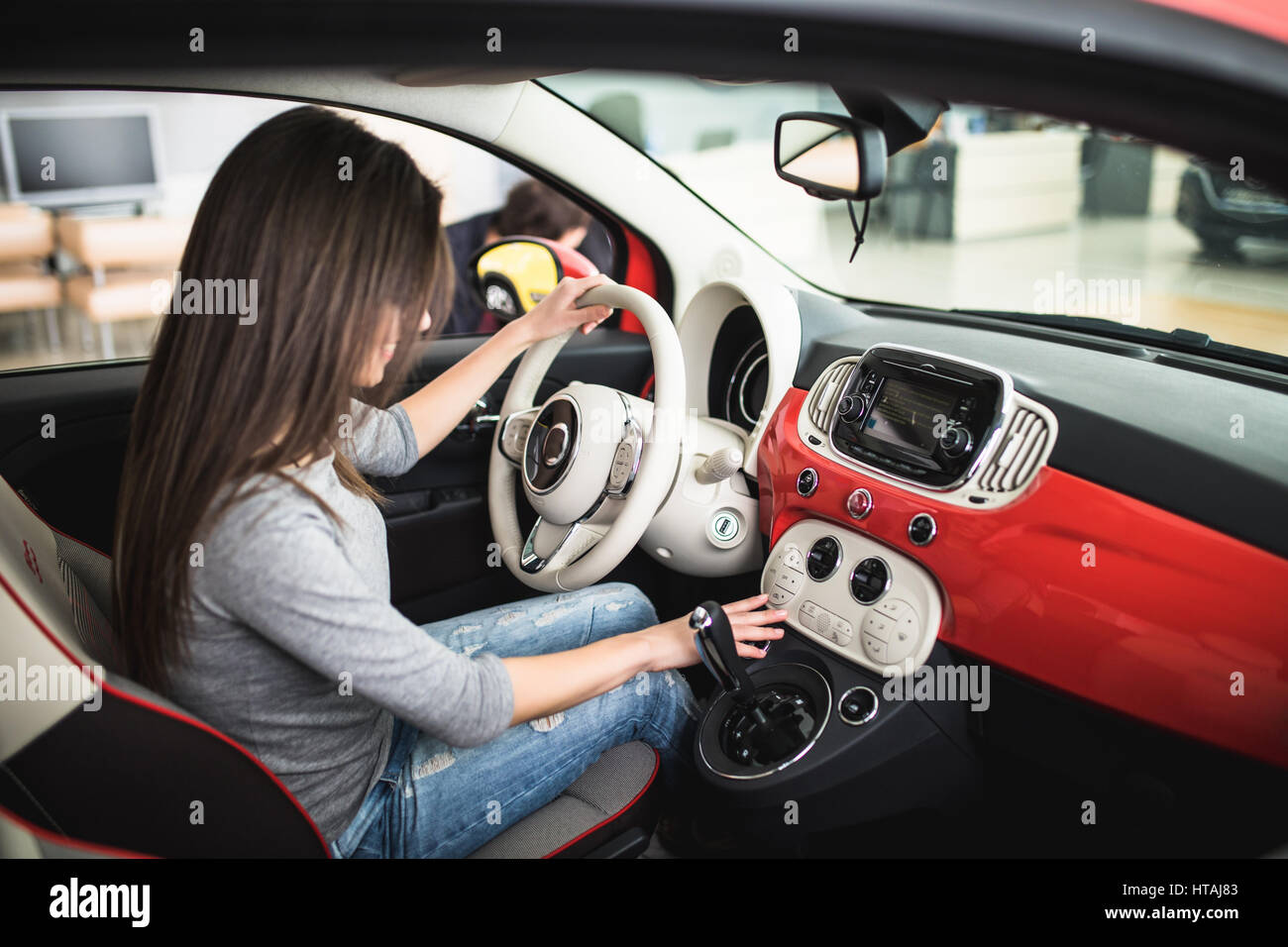 Woman driving new and modern car and use dashboard panel in car Stock ...