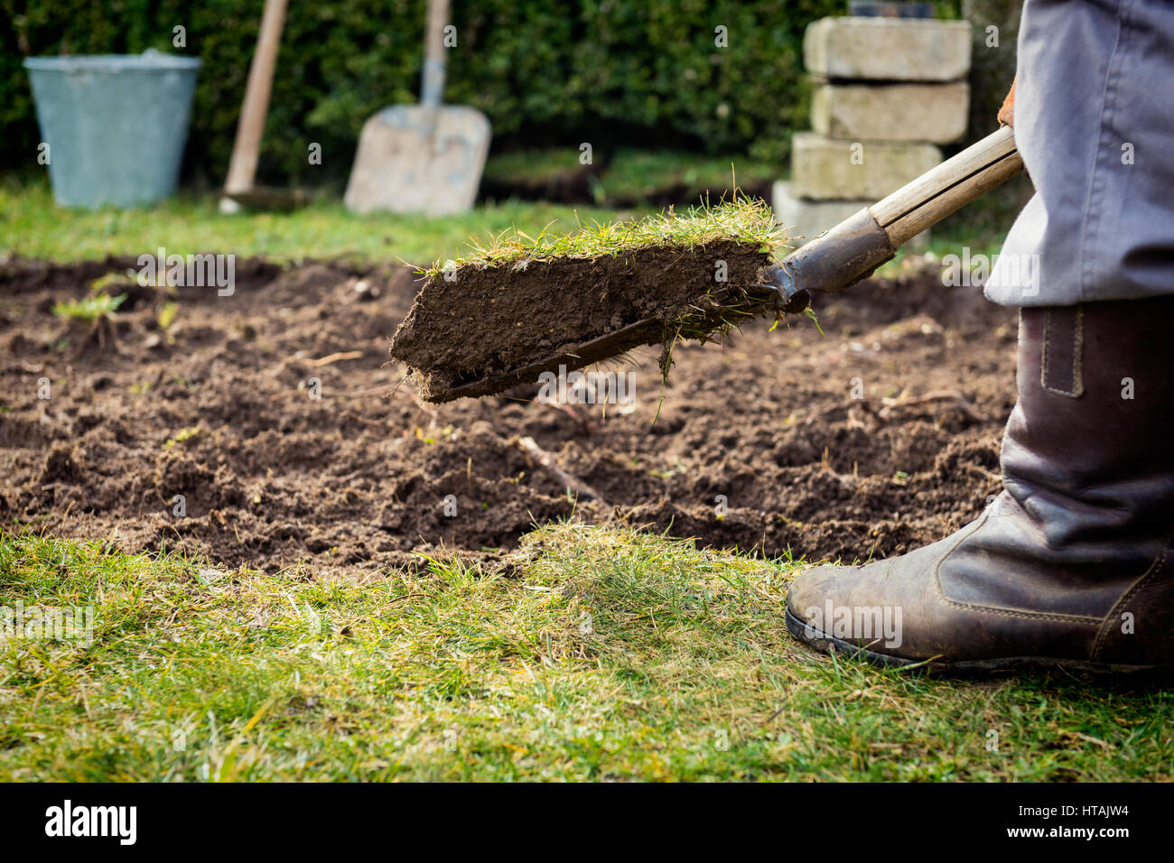 Man using garden spade hi-res stock photography and images - Alamy