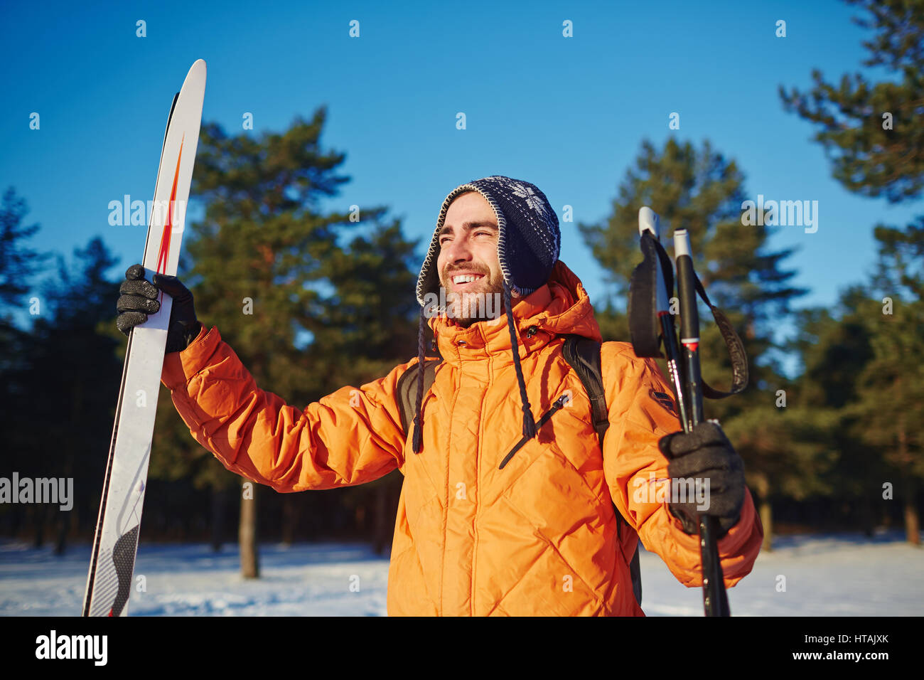 Happy young skier enjoying winter day in the forest Stock Photo - Alamy
