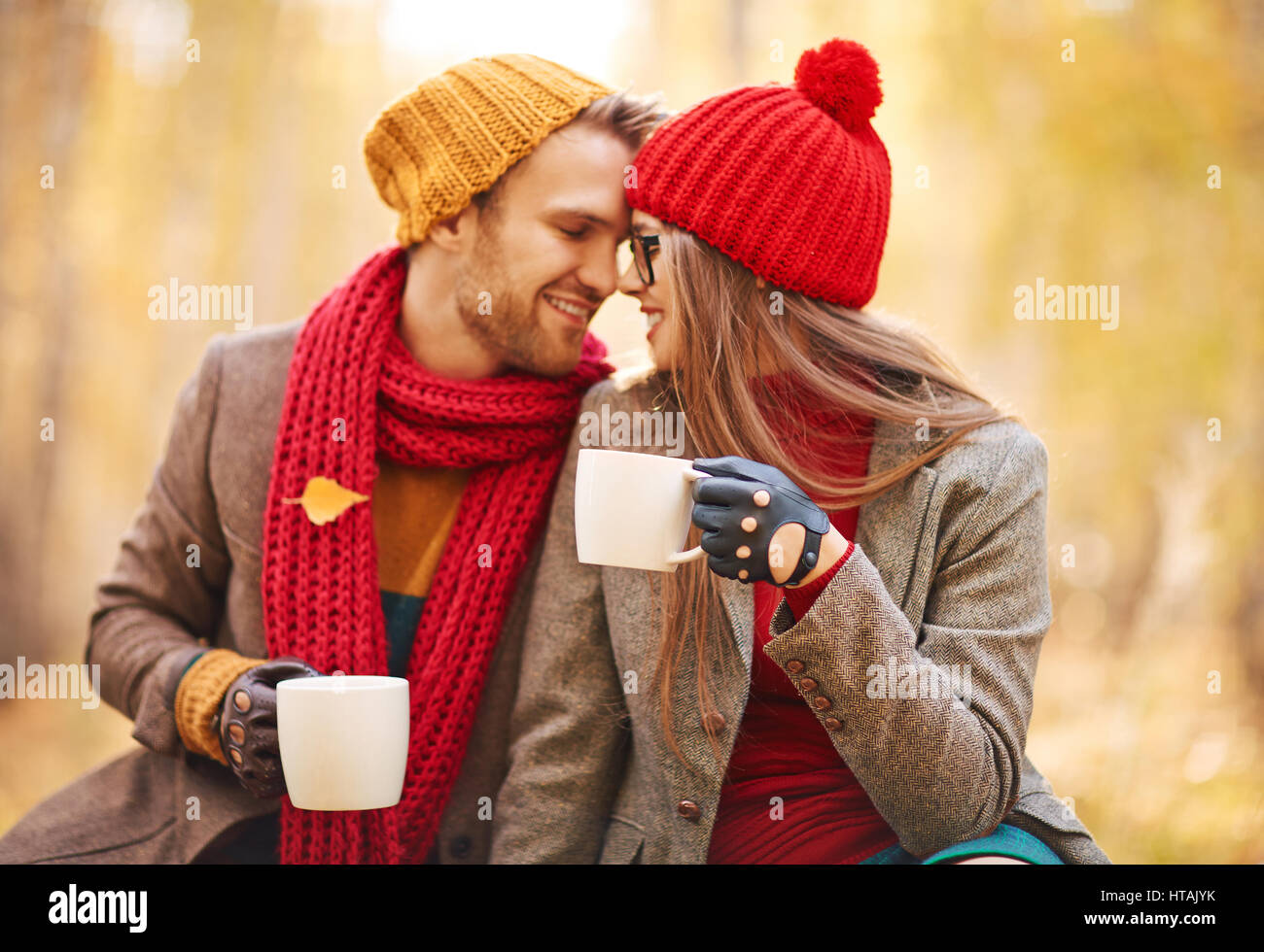 Romantic couple with cups drinking tea outdoors Stock Photo - Alamy