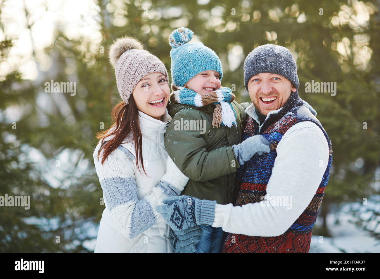 Ecstatic family enjoying winter day Stock Photo - Alamy