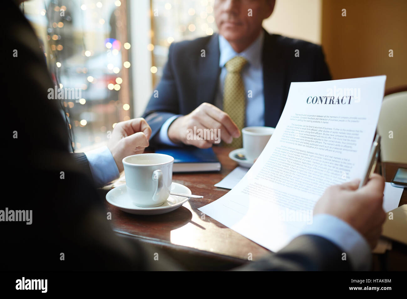 Contract held by businessman during negotiation with partner Stock ...