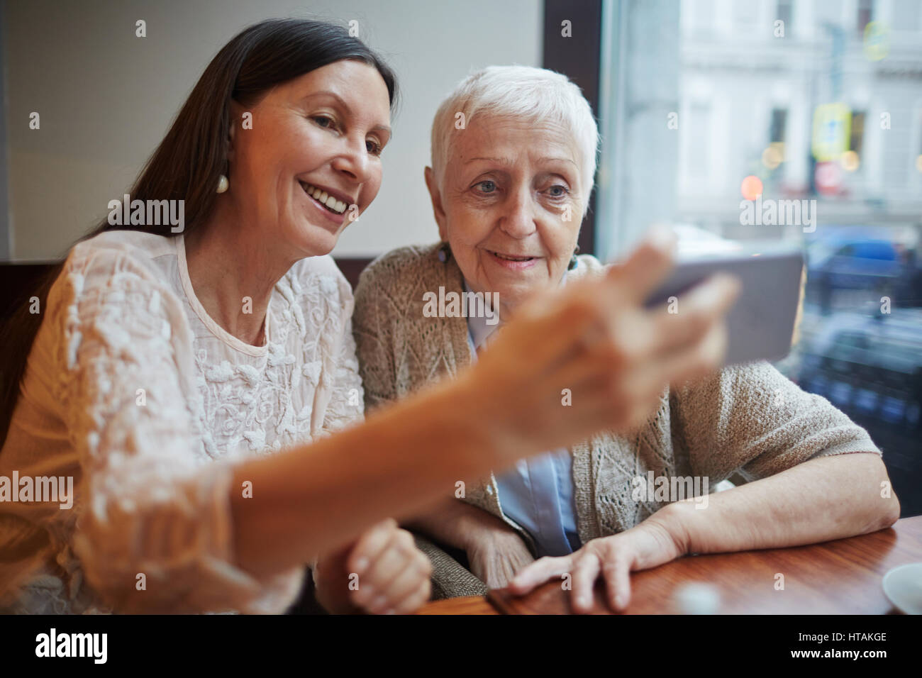 Smiley mature woman making hi-res stock photography and images - Alamy
