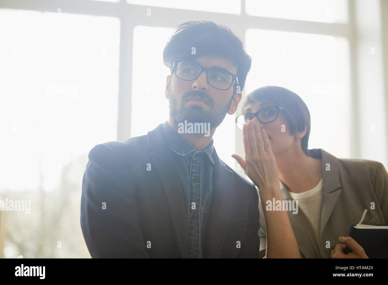 Office office workers whisper whisper hi-res stock photography and ...