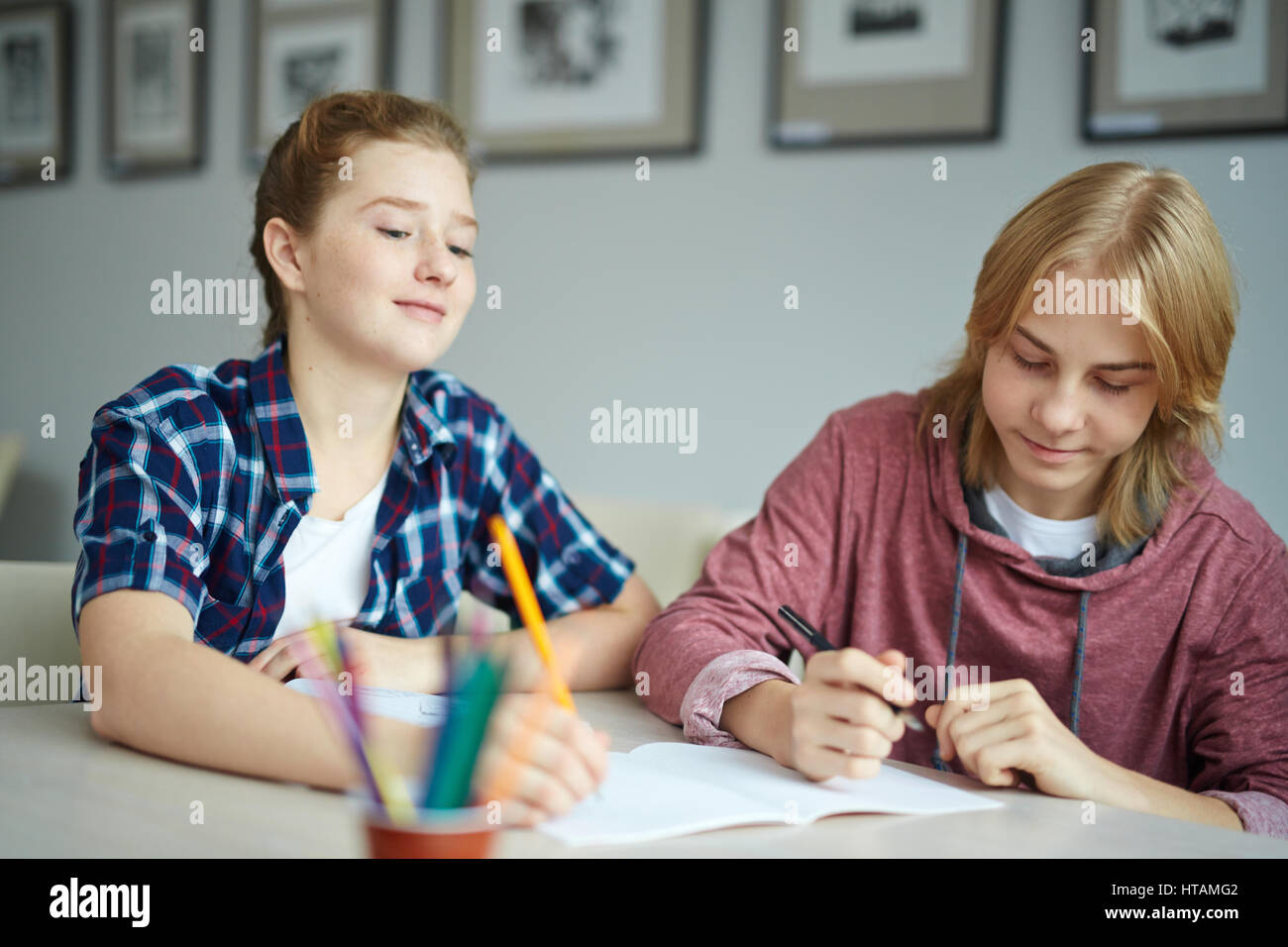 Two classmates making notes hi-res stock photography and images - Alamy