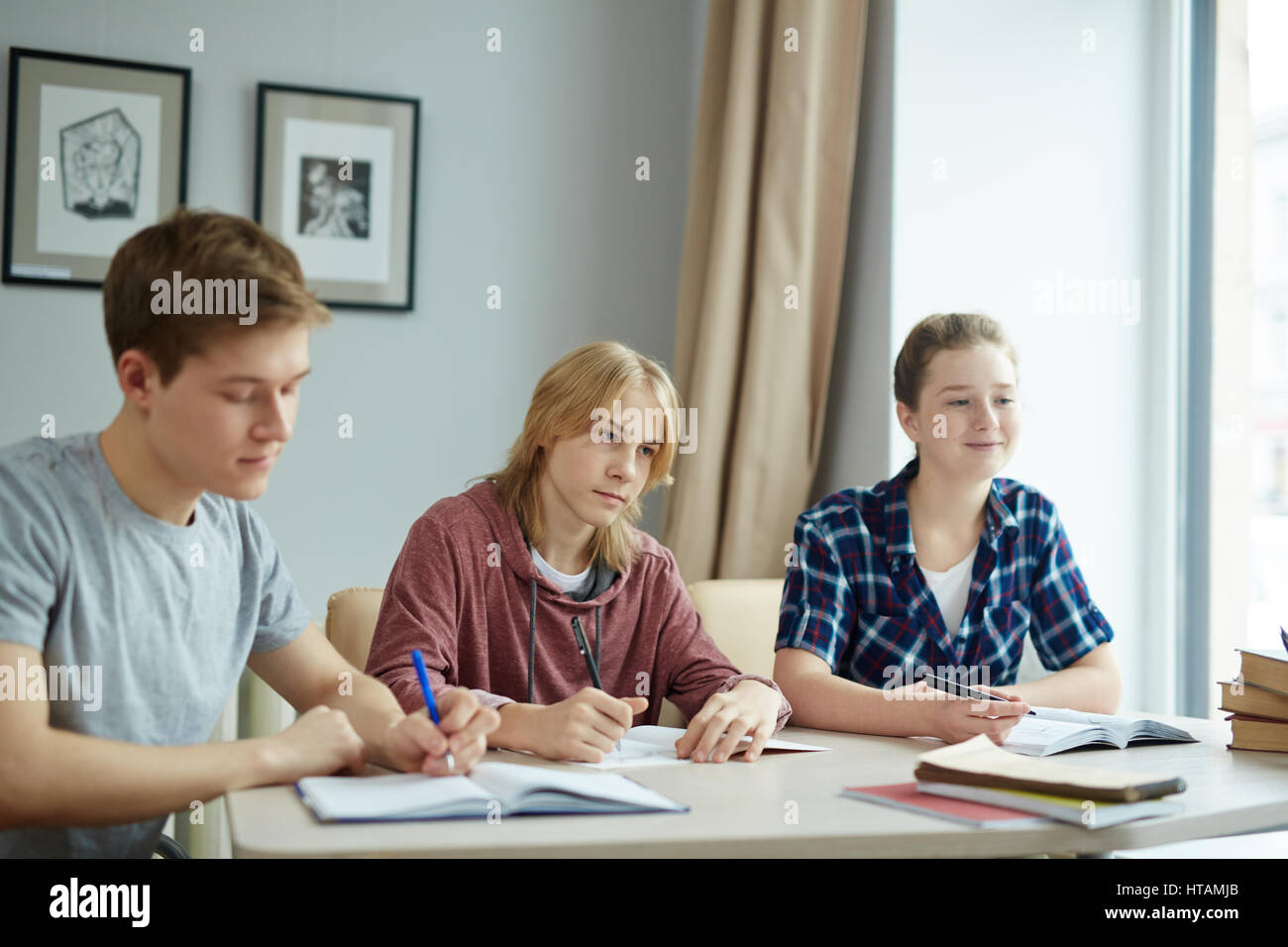 Clever teenage students studying in college Stock Photo - Alamy