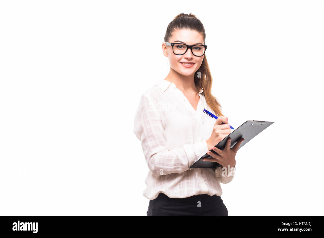 Beautiful business woman taking notes on her clipboard isolated on ...