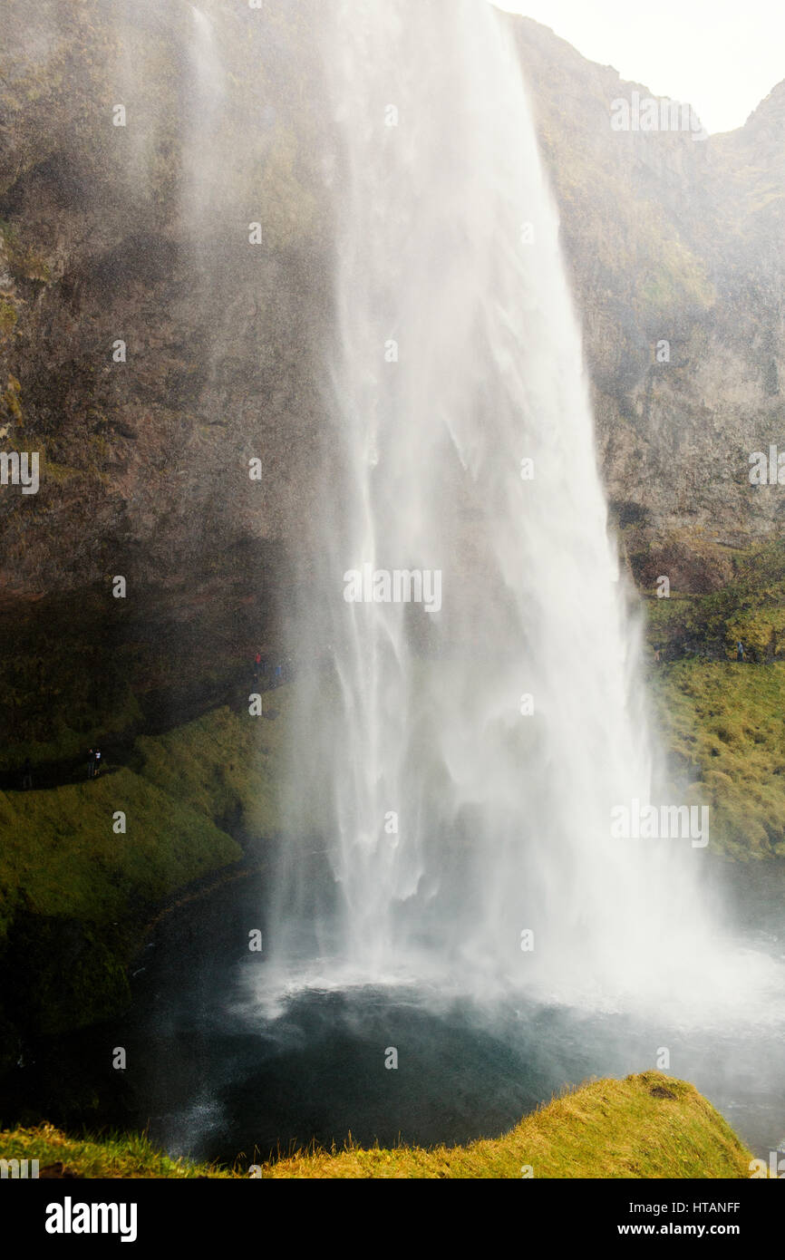 Rapid waterfall flowing into small river Stock Photo - Alamy