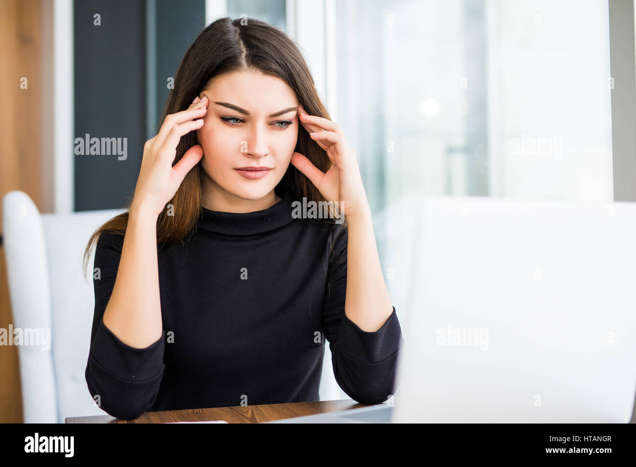 Beautiful tired business woman is holding eyeglasses and massaging her ...