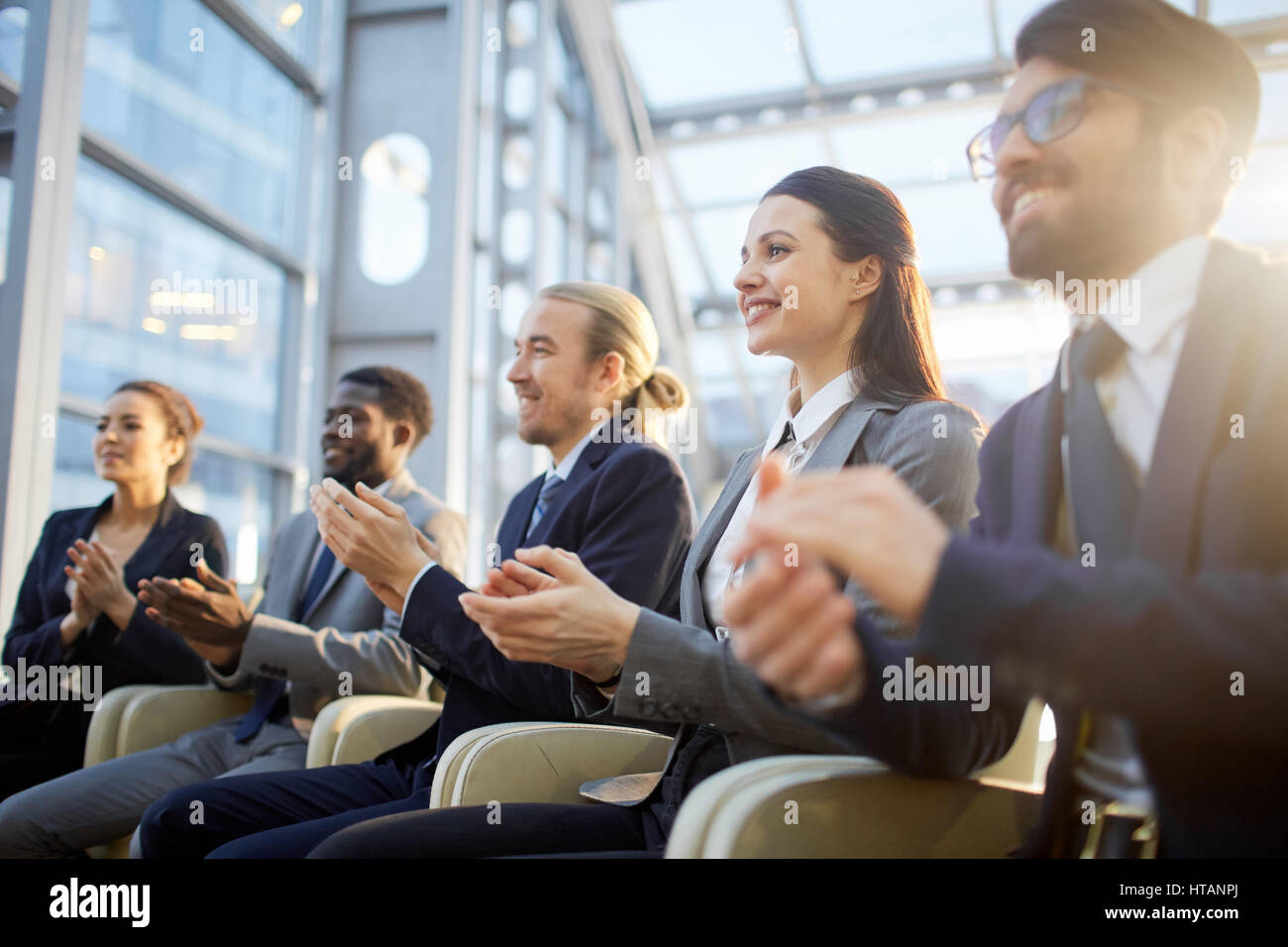 Successful business staff applauding to speaker Stock Photo - Alamy