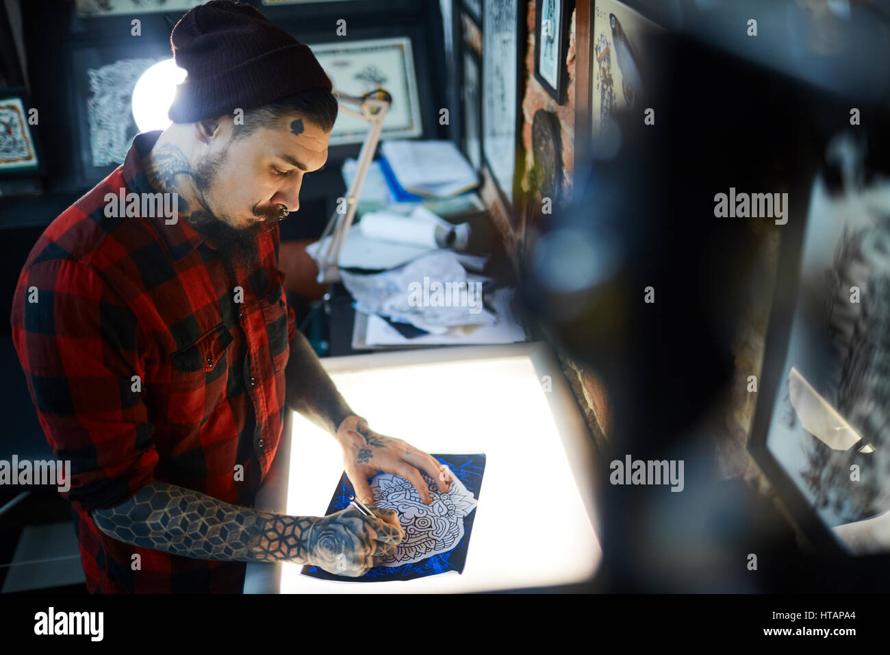 Creative young man making sketch of ornament Stock Photo - Alamy