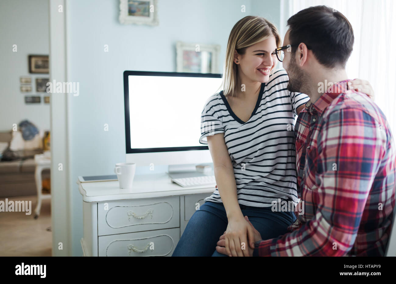 Supportive woman caring for husband working from home Stock Photo - Alamy